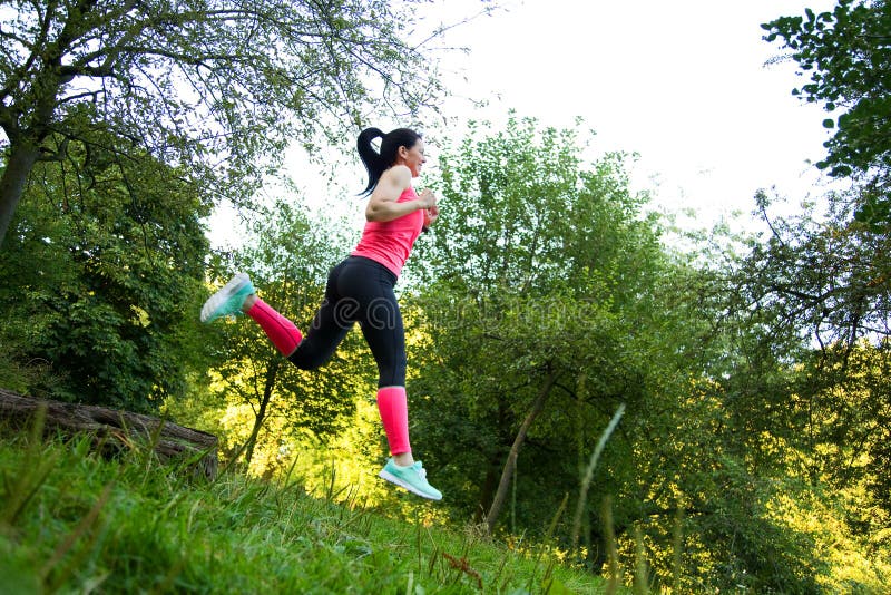 Running in nature stock photo. Image of jogging, body - 76715096