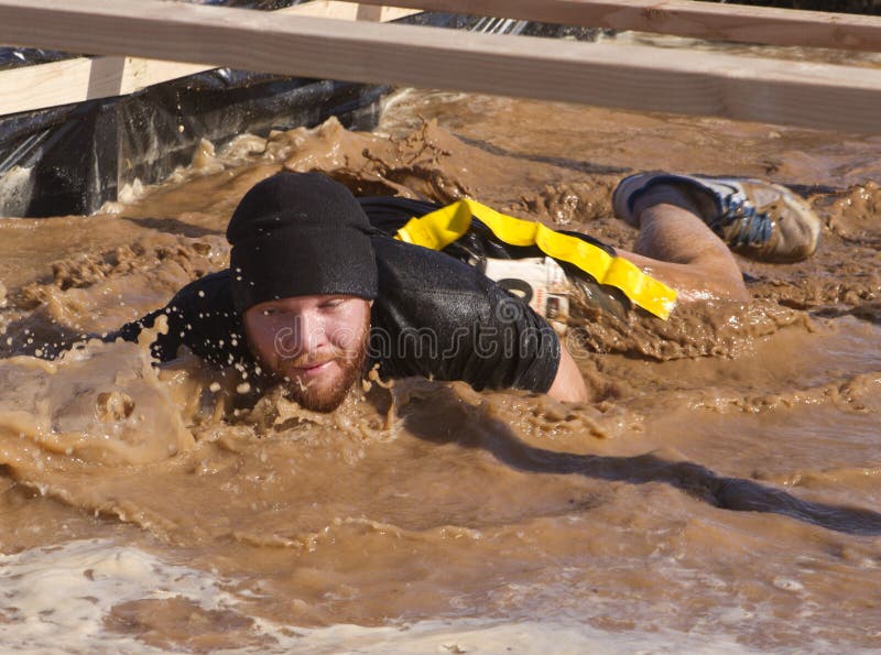 Running, Mud, and Obstacle Course Editorial Stock Image - Image of ...