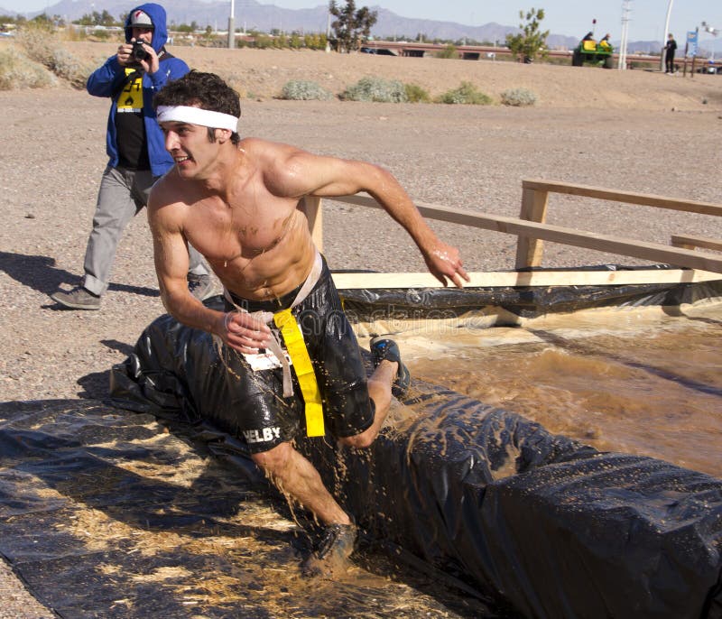 Running, Mud, and Obstacle Course Editorial Stock Image - Image of ...