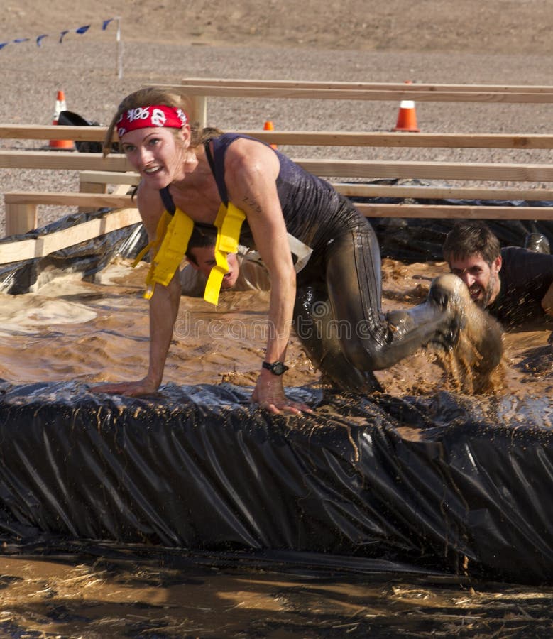Woman Competing and Struggling in Mud in Obstacle Course Editorial ...