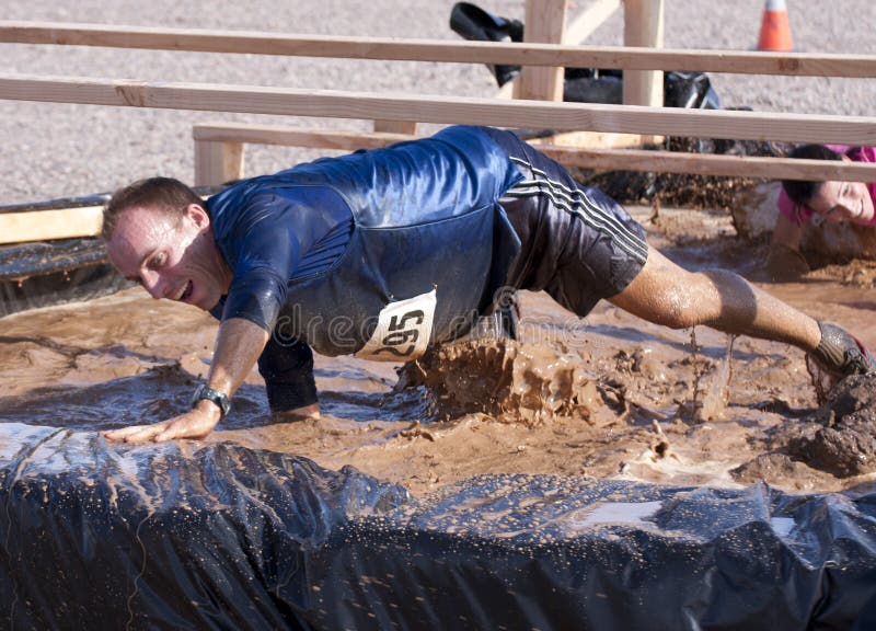 Running, Mud, and Obstacle Course Editorial Stock Image - Image of ...