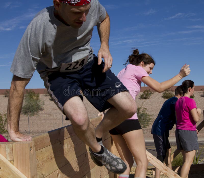 Running, Mud, and Obstacle Course Editorial Stock Image - Image of ...