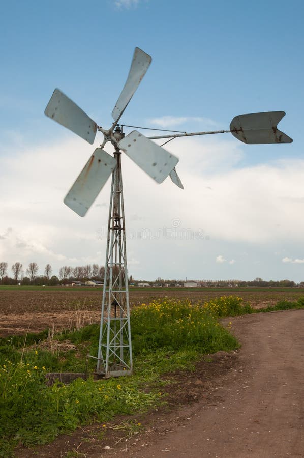 Running old metal windmill stock photo. Image of retro - 24490460