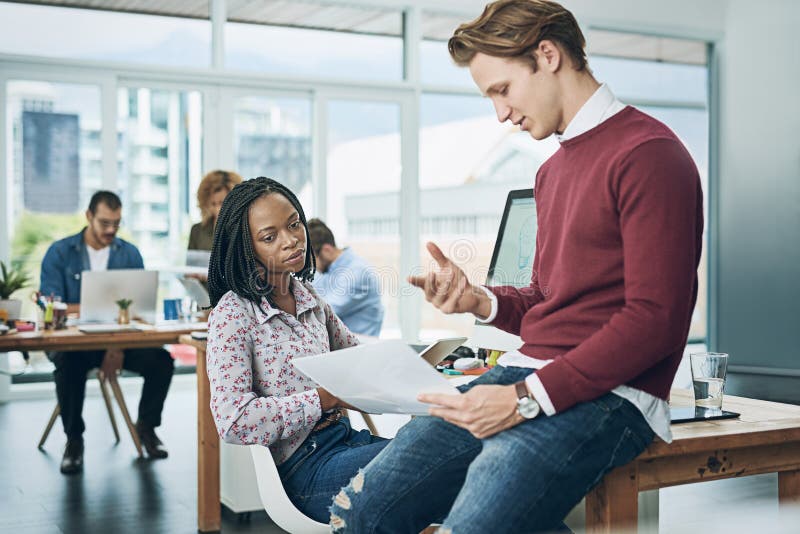 Running Operational Reports As a Team. Two Young Colleagues Discussing ...