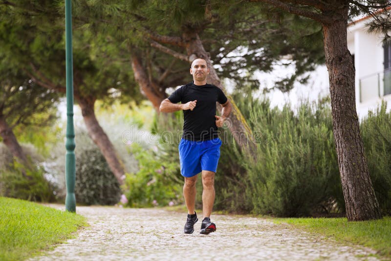 Running at the park stock image. Image of exercise, grass - 35610025