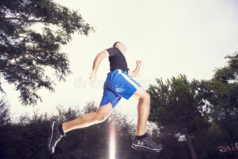 Single Runner Running in Rain Stock Image - Image of jogger, sport ...