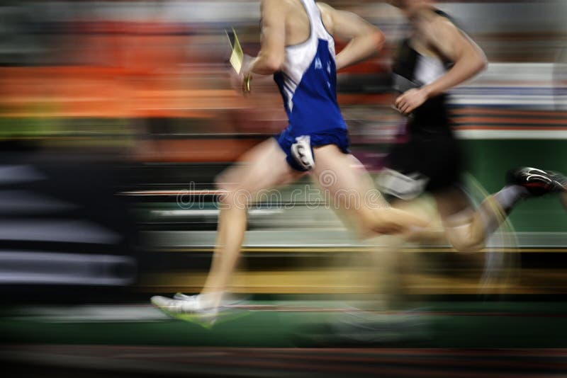 Running a Relay Race on Tract Holding Baton Stock Photo - Image of ...