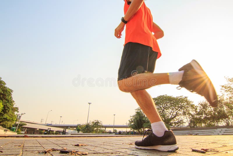 Running on the Road with Sunlight / the Man Runner Stock Image - Image ...