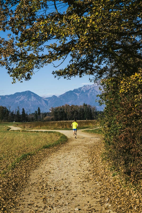 Running on rural road stock photo. Image of endurance - 98518908