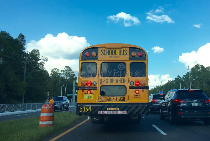 A running school bus editorial stock photo. Image of auto - 76970823