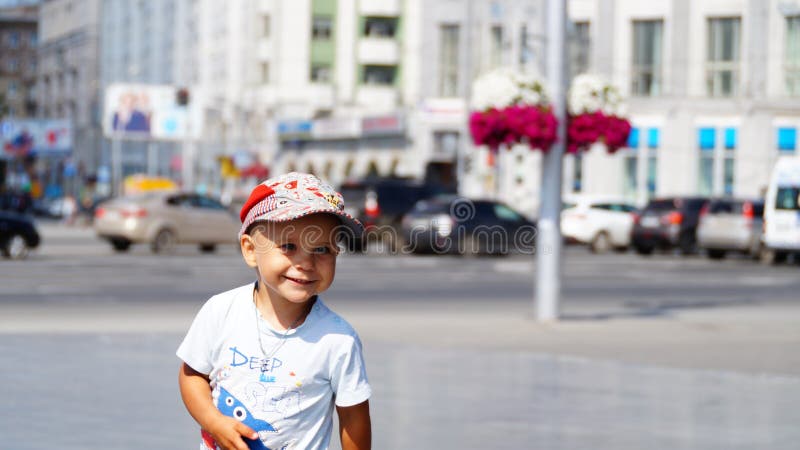 Running smiling boy stock image. Image of city, children - 82131035