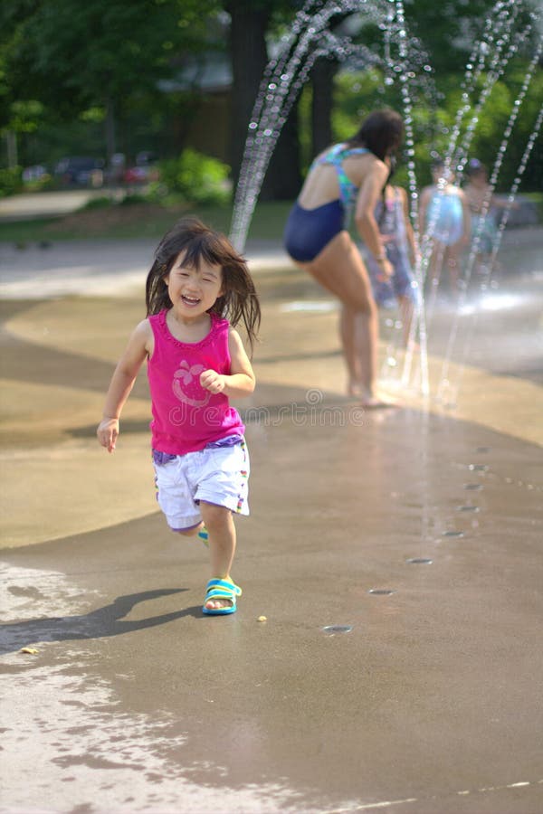 Running spray pad stock image. Image of outdoors, beauty - 32582967