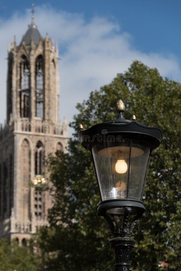 Running Street Light with Medieval Gothic Tower Behind it Stock Photo ...