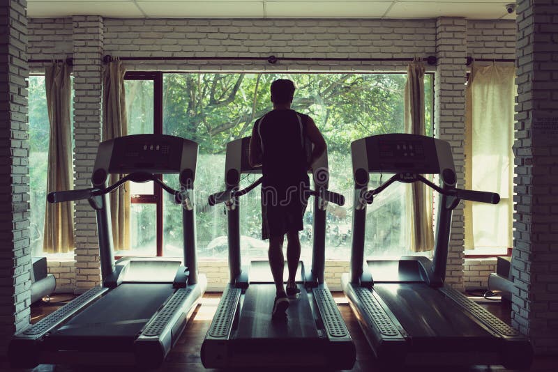 Running on threadmill stock photo. Image of back, lifestyle - 115349498