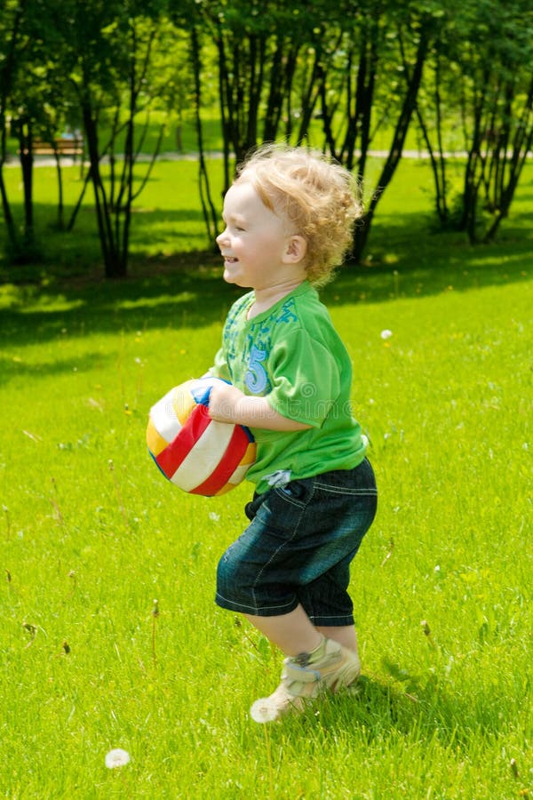 Toddler running stock photo. Image of green, blond, person - 20030788