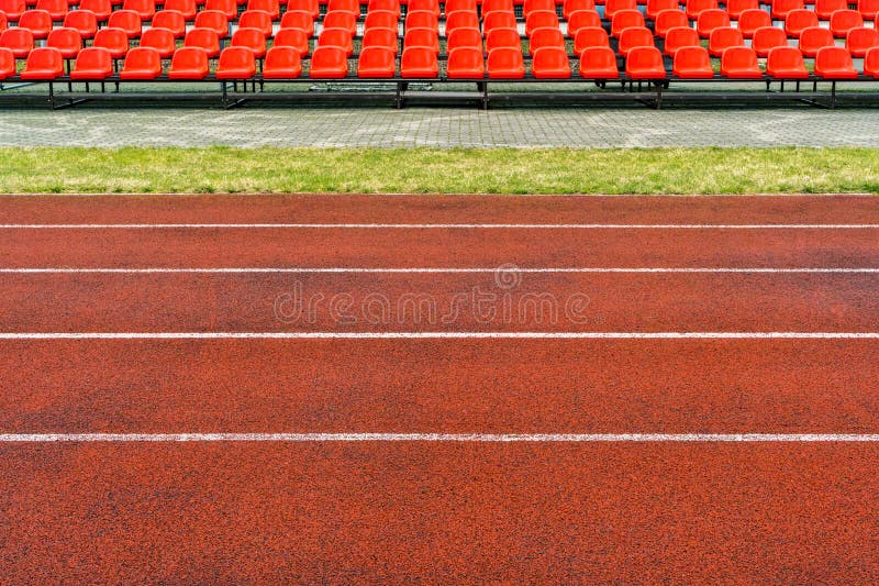 Running Track and Red Plastic Chairs on a Sports Stadium Stock Photo ...