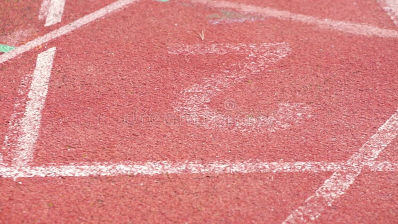 Running Track, Starting Line Numbers. Panning Shot of Athletics Track ...