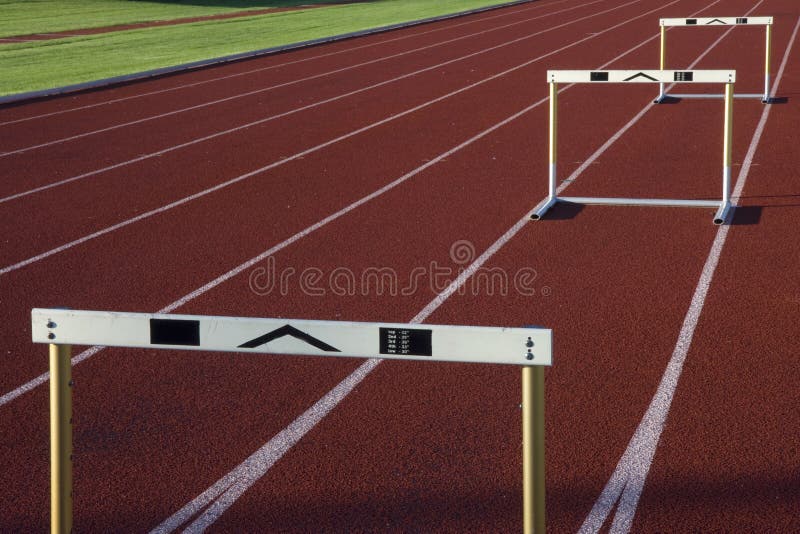 Running Tracks with Three Hurdles Stock Photo - Image of hurdle, green ...