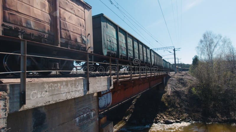 Running Train on Old Bridge Over River. Clip. Freight Train Passing ...