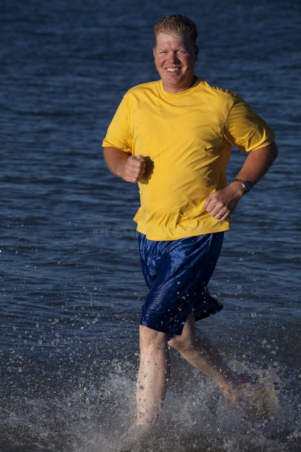 Running in water stock photo. Image of practice, male - 15189872