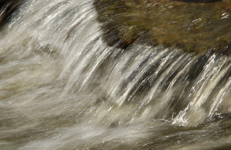 Running water over rocks stock photo. Image of texture - 194656140