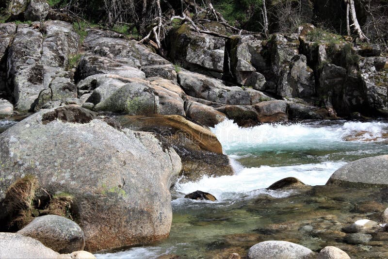 Running water and rocks stock image. Image of midst - 114054957