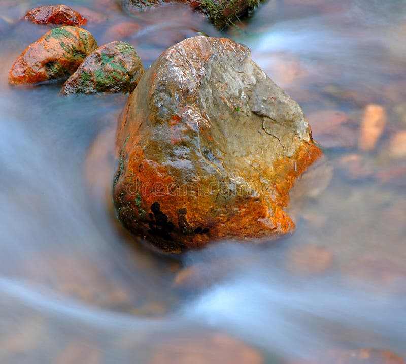 Running water and stones stock photo. Image of worn, flow - 4421500