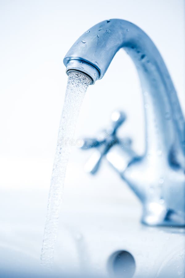 Running water tap closeup stock photo. Image of pure - 74085430