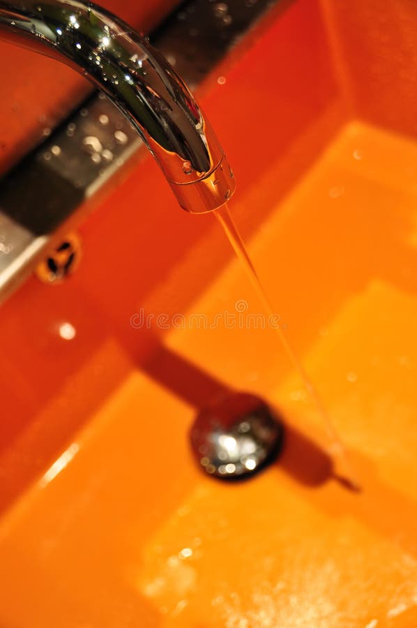 Running Water from Tap with Orange Basin Stock Photo - Image of ...