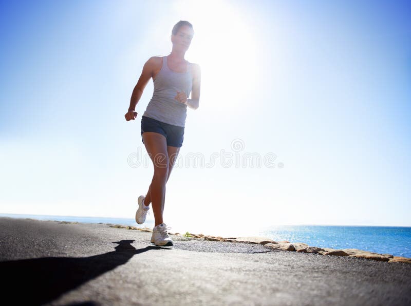 Running is a Way of Life. Low Angle View of a Runner Next To the Ocean ...