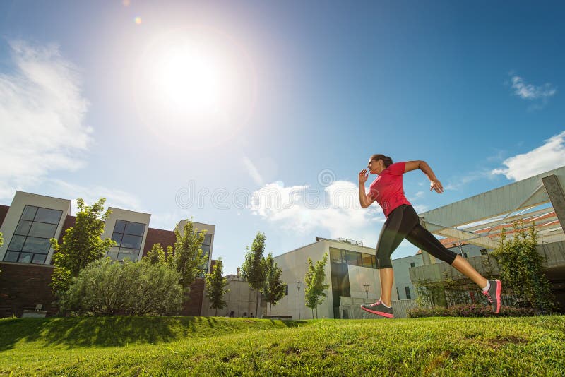Running Woman Outdoors Behind Buildings Stock Photos - Free & Royalty ...