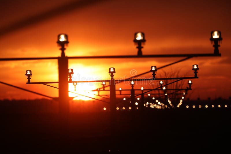 Runway Lights, Orange Sunset Stock Photo - Image of runways, sunset ...