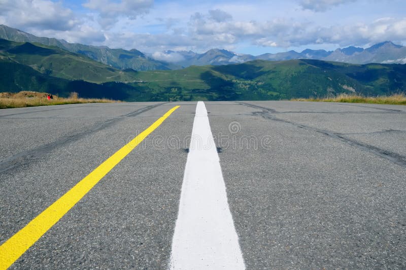 Runway between mountains stock image. Image of landing - 132048361