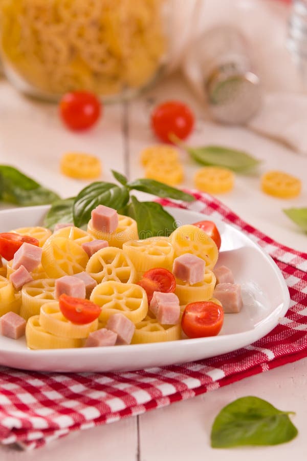 Ruote Pasta with Tomato and Ham. Stock Photo - Image of dinner, green ...