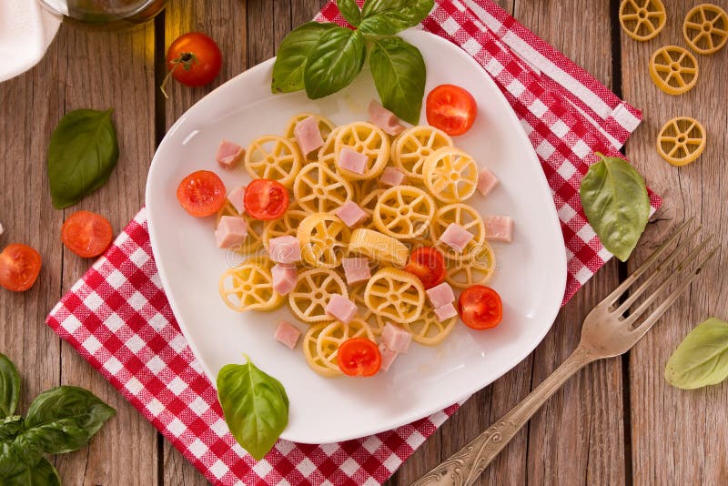 Ruote Pasta with Tomato and Ham. Stock Photo - Image of meal, cherry ...
