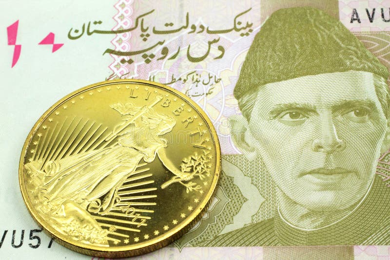 A Rupee Note from Pakistan with a Gold Coin in Macro Stock Photo ...