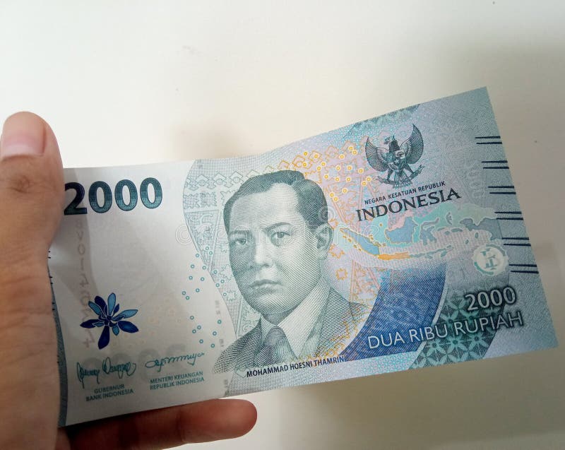 2000 Rupiah Bill Money Holding Hands Isolate in White Stock Image ...