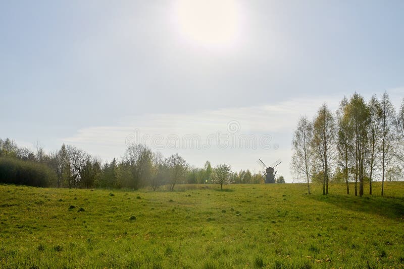 A Rural Area Where an Old Mill is Located in the Distance Stock Photo ...