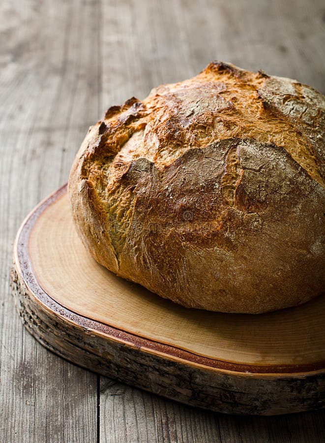 Baker Man Holding Rustic Loaf of Bread and Wheat in Hands Stock Photo ...