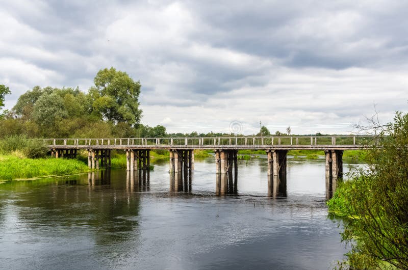 Rural bridge and river stock photo. Image of european - 116874108