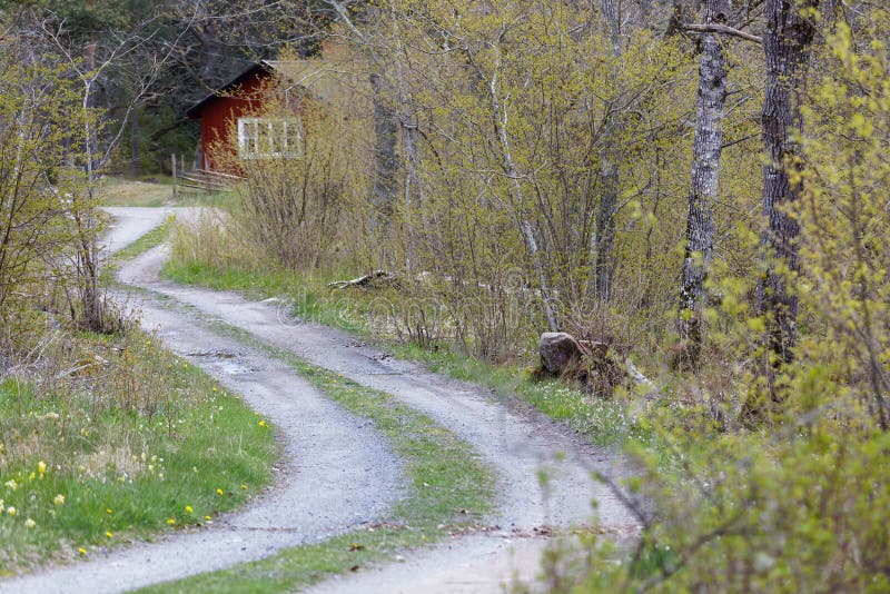 Rural Country Road during Spring and a Red Cottage Stock Photo - Image ...