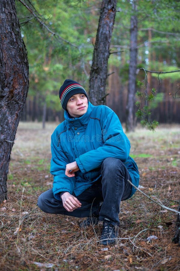 A Rural Guy Posing in a Pine Forest in the Autumn Time. Stock Image ...