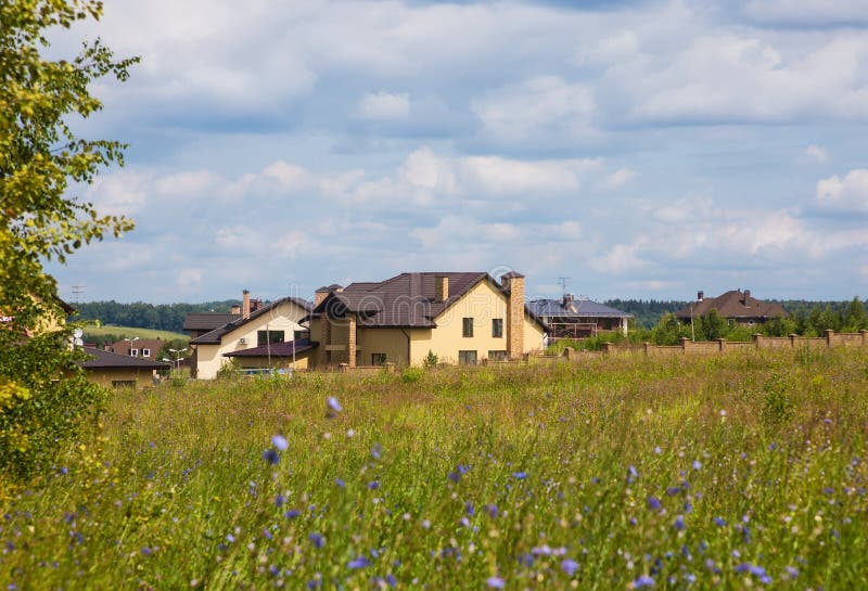 Cottages in the Field by the Sea Stock Photo - Image of beautiful ...