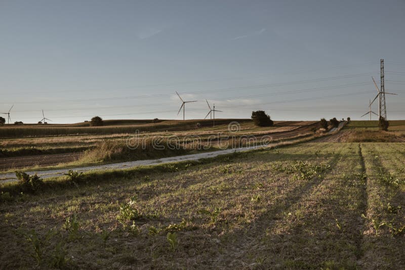 Rural Landscape with Empty Fields and Wind Turbines Stock Image - Image ...
