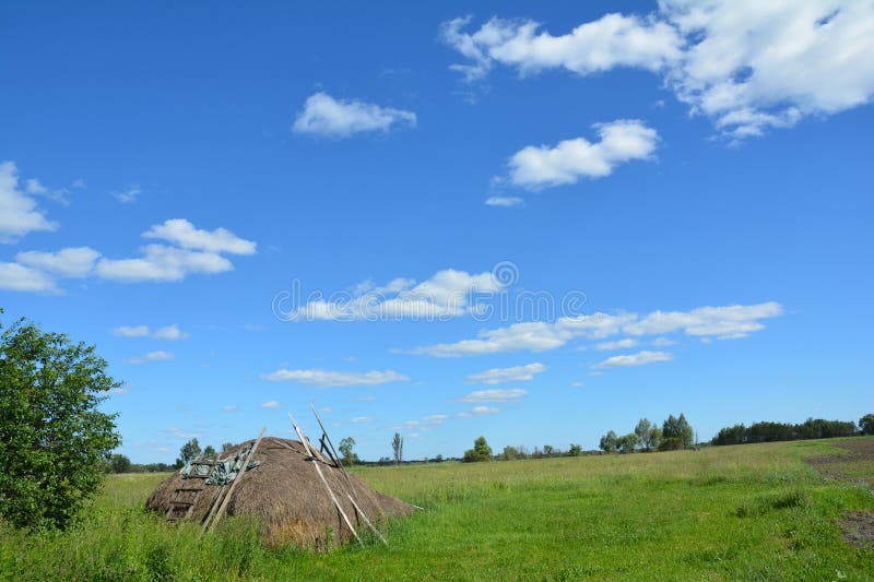 Rural Landscape with a Stack of Dry Hay in the Field. Stack Dry Hay in ...