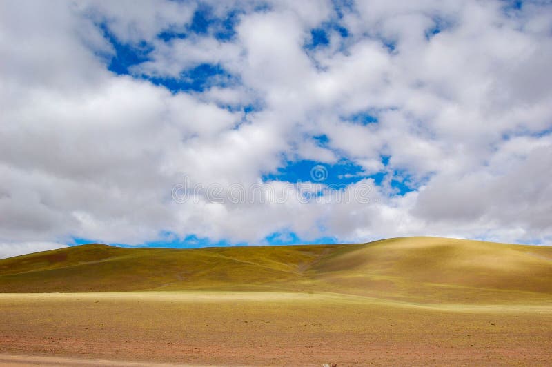 Rural Landscape with Vast Open Golden Valley Under Blue Cloudy Sky ... Rural Landscape with Vast Open Golden Valley Under Blue Cloudy Sky ...