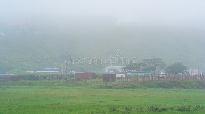 Rural Landscape with Vegetable Gardens and Barns in Thick Fog Stock ...