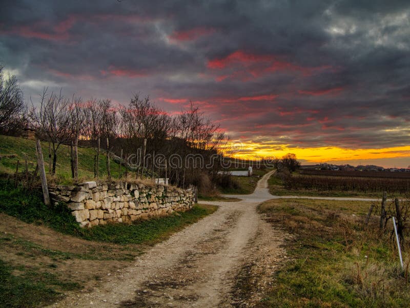 Rural Path at Sunset with Dramatic Clouds Stock Image - Image of wall ...