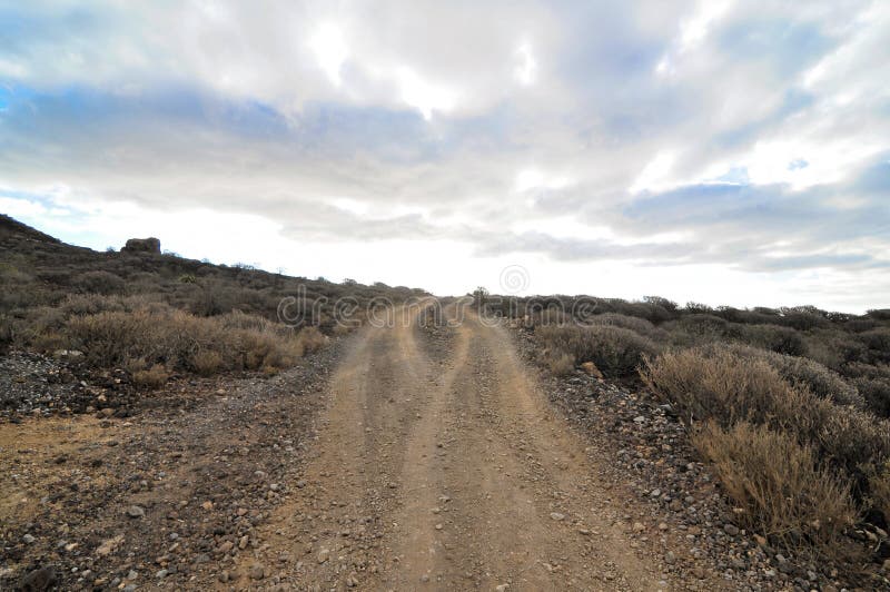 Rural Road through a Deserted Arid Area Stock Photo - Image of nature ...