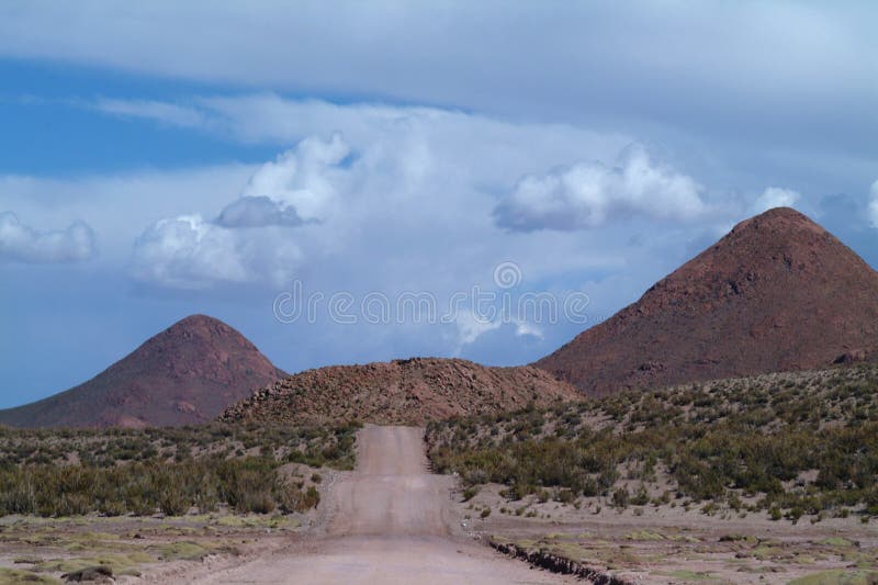Rural Road in Mountains with Overhanging Clouds on a Sunny Day Stock ...